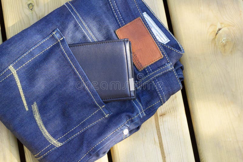 Mans Folded Jeans and Wallet Stock Photo - Image of mens, jeans: 40999970