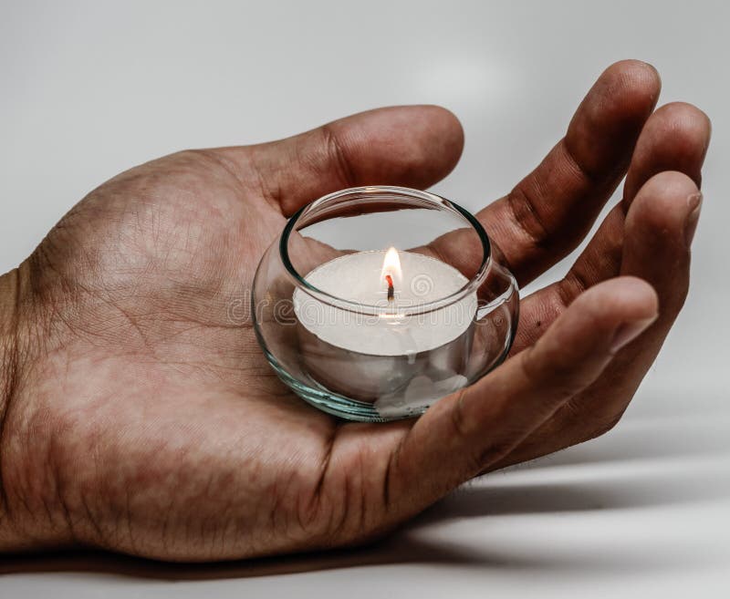 Mans hand and candlelight stock image. Image of hand - 39656021
