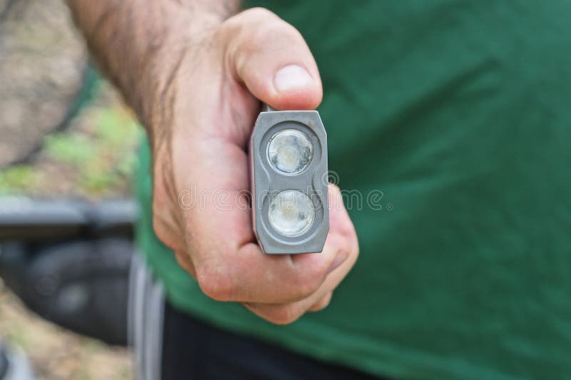 Mans Hand Holding One Plastic Mechanical Flashlight Stock Photo - Image ...