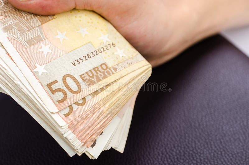 Mans Hand Holding Several 50 Euro Banknotes Stock Photo - Image of ...