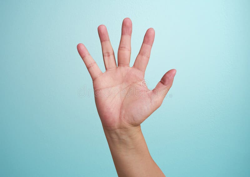 Mans Hand Isolated on Blue Background . Stock Image - Image of hand ...