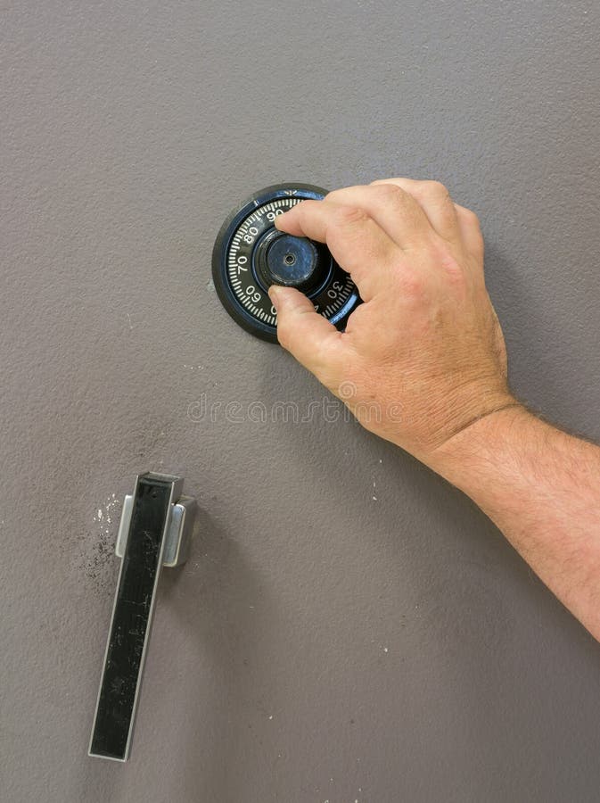 Mans hand opening safe. stock image. Image of combination - 31439191