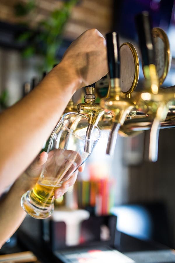 Mans hand pouring beer stock image. Image of staff, barkeeper - 33386561