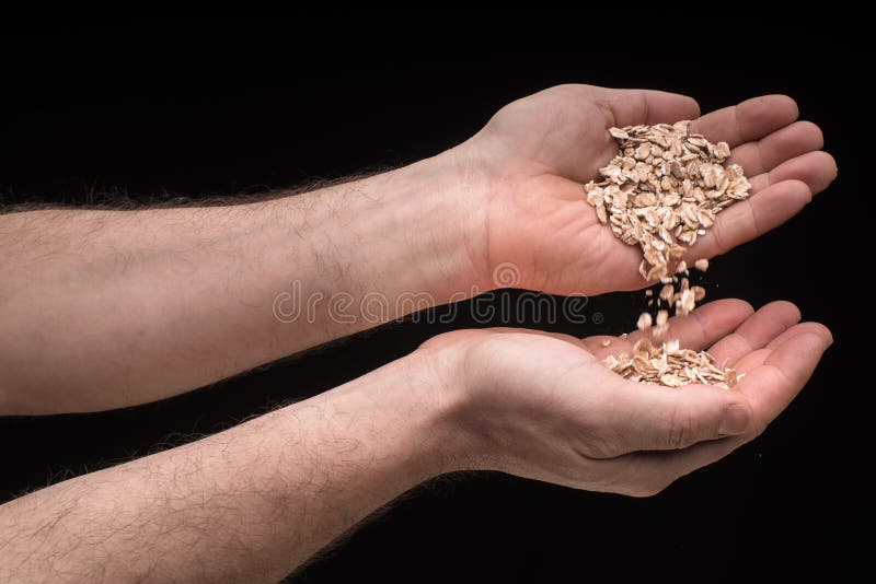 Mans Hand Pouring Spelt Flakes from One Hand To the Other Stock Image ...