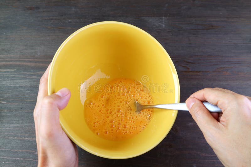 Hands Holding Mixing Bowl while Beating Eggs for Cooking Stock Image ...