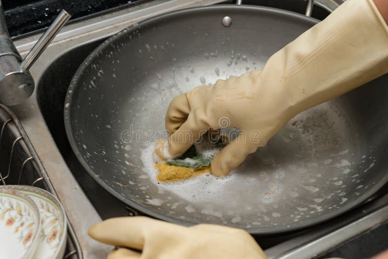 Mans Hands Washing a Pan in the Kitchen Sink with Sponge Stock Image ...