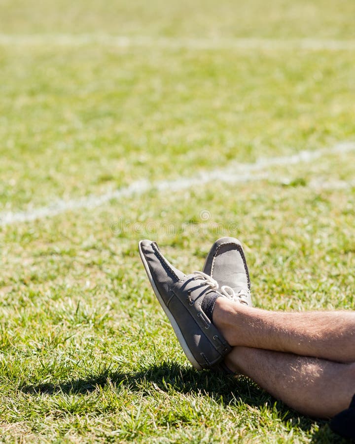 Mans Legs Relaxing on a Grass Field Stock Photo - Image of resting ...
