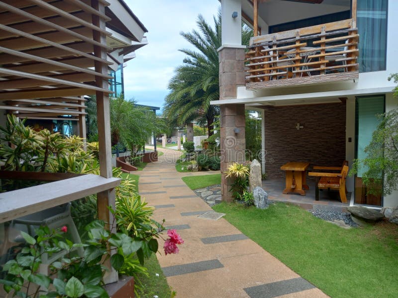 Mansion on the Middle of Asphalt Road Leading To the Beach with Clear ...