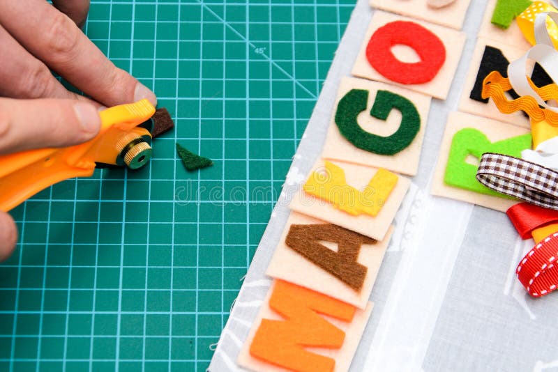 Manual Cutting Letters with Colored Sheets of Felt Stock Photo - Image ...