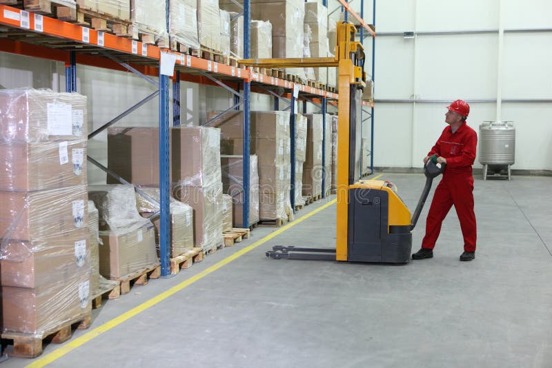 Manual Forklift Operator at Work in Warehouse Stock Image - Image of ...