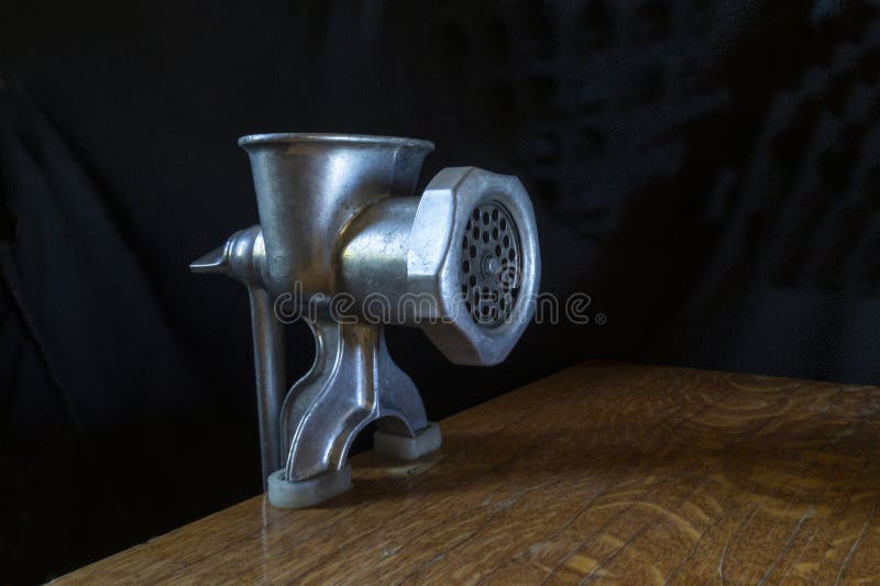 Manual Meat Grinder Made of Metal on a Wooden Table Stock Image - Image ...