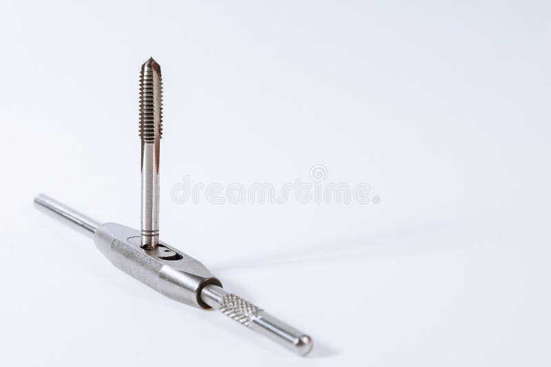 Manual Tap for Cutting Threads in Metal on a White Background. Metal ...