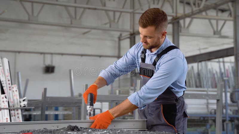 Manual Worker Assembling PVC Doors and Windows and Working with Gun ...