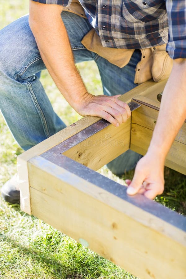 Manual Worker Measuring Wood with Scale at Stock Image - Image of ...