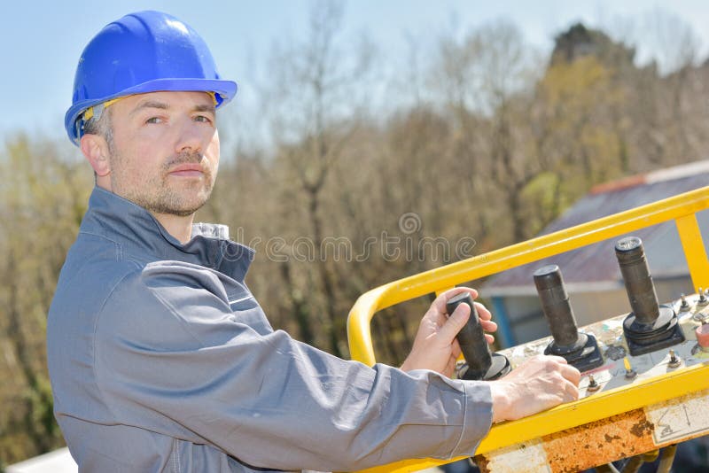 Manual Worker Operating Crane Stock Image - Image of holding, working ...