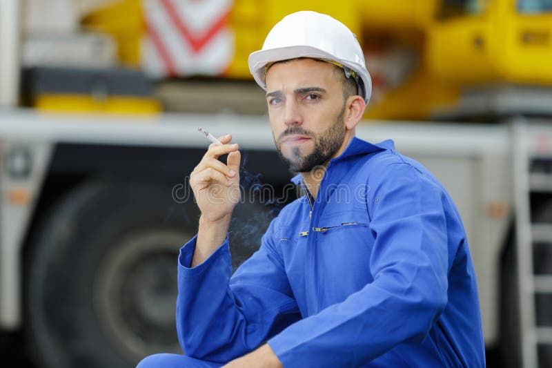 Manual Worker Smoking Cigarette Stock Image - Image of overalls ...