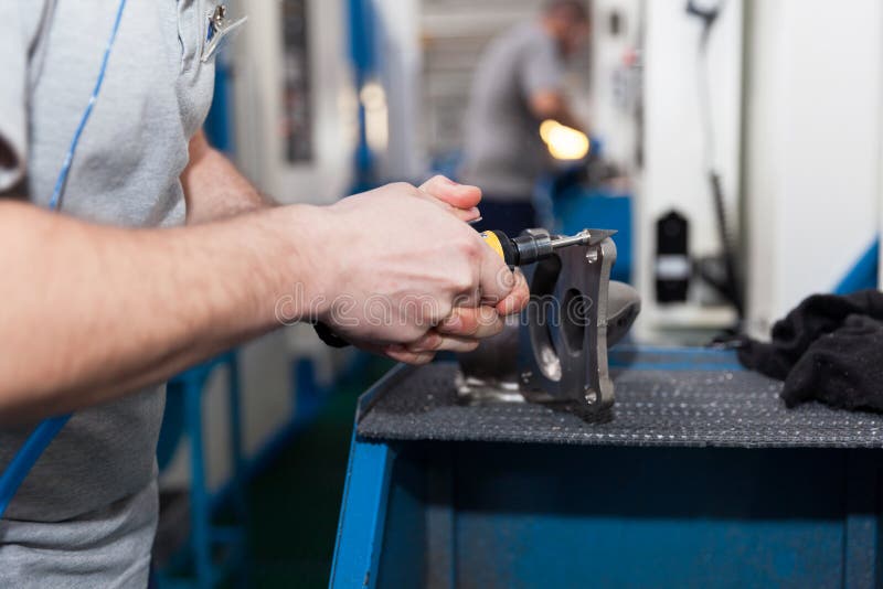 Manual Worker at Work in the Automotive Industry Factory Stock Image ...