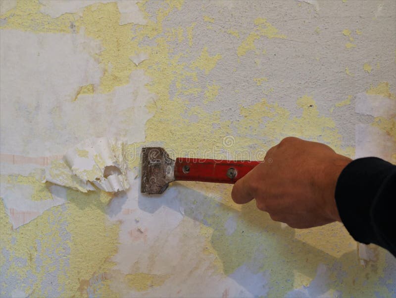 Manually Scraping Debris Off the Wall Stock Image - Image of interior ...