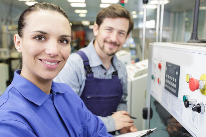 Manufacture Workers Working on Electronic Machine Stock Photo - Image ...