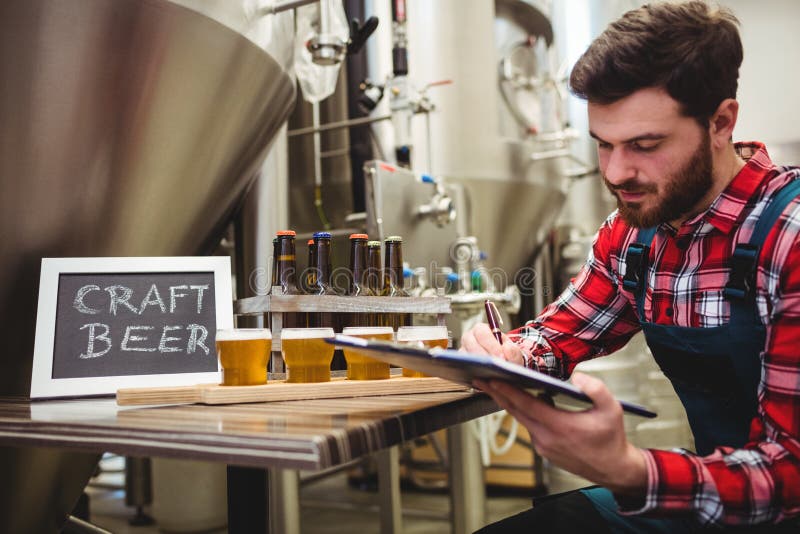 Manufacturer Writing on Writing Pad in Brewery Stock Photo - Image of ...