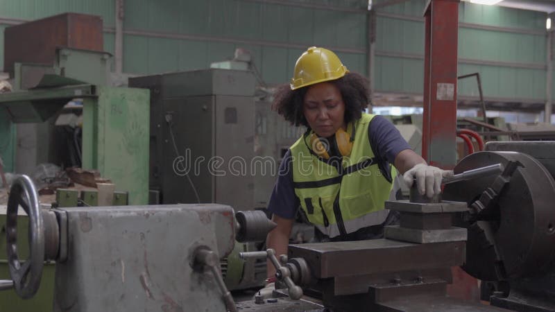 Manufacturing Worker. African American Mechanical Engineer Operating ...