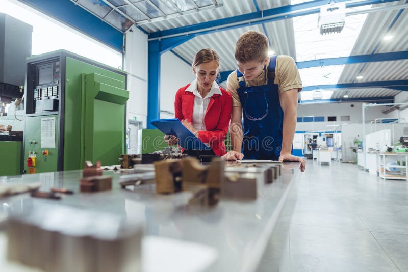 Manufacturing Worker and Manager during Quality Inspection Stock Photo ...