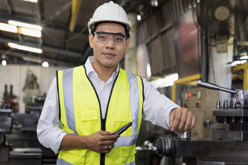 Manufacturing Worker. Professional Asian Worker Controlling the Work ...