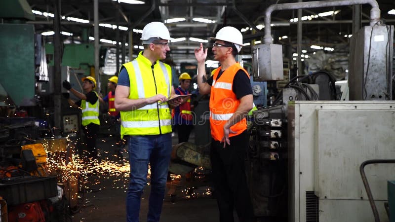 Manufacturing Worker Using Computer Tablet in Factory. Asian Worker ...