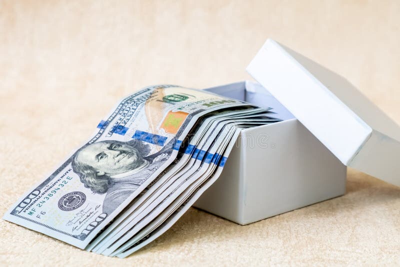 Many American Dollar Banknotes of 100 Dollars in White Gift Box. Stock ...