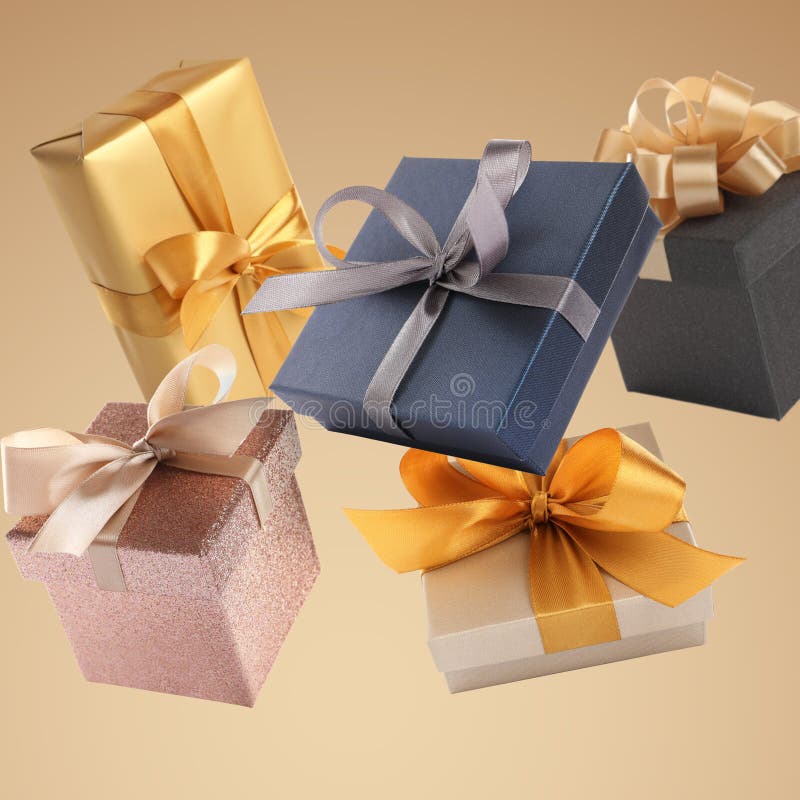 Many Beautiful Gift Boxes Falling on Dark Beige Background Stock Image ...