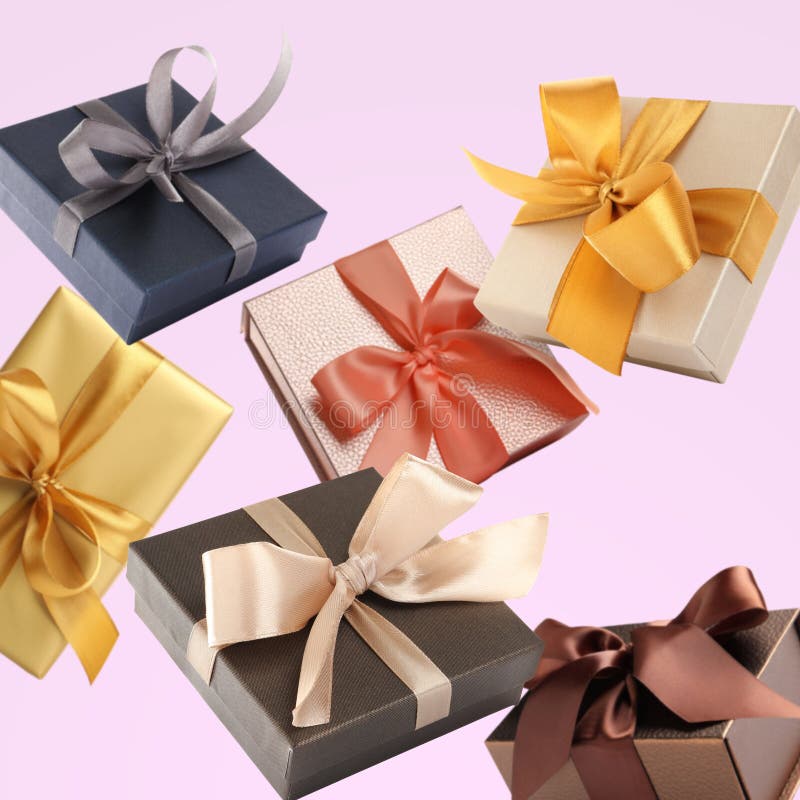 Many Beautiful Gift Boxes Falling on Pastel Pink Background Stock Photo ...