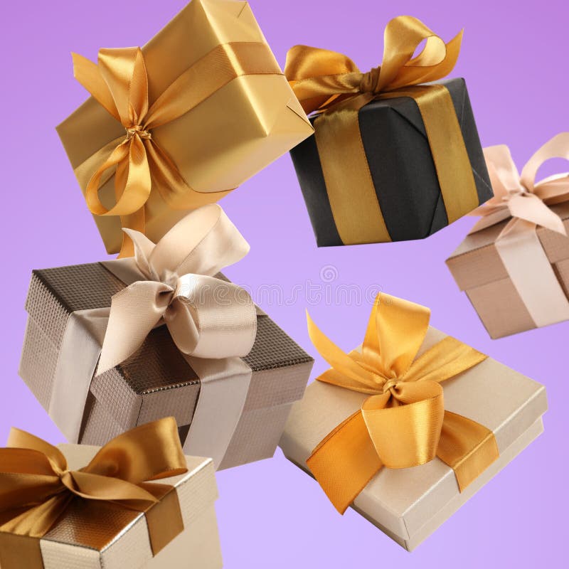 Many Beautiful Gift Boxes Falling on Violet Background Stock Photo ...