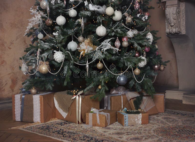 Many Beautiful Gifts, in a Rustic Style, Lie Under a Decorated ...