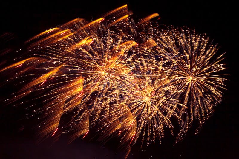 Many Beautiful Golden Fireworks Exploding in the Night Sky Stock Photo ...