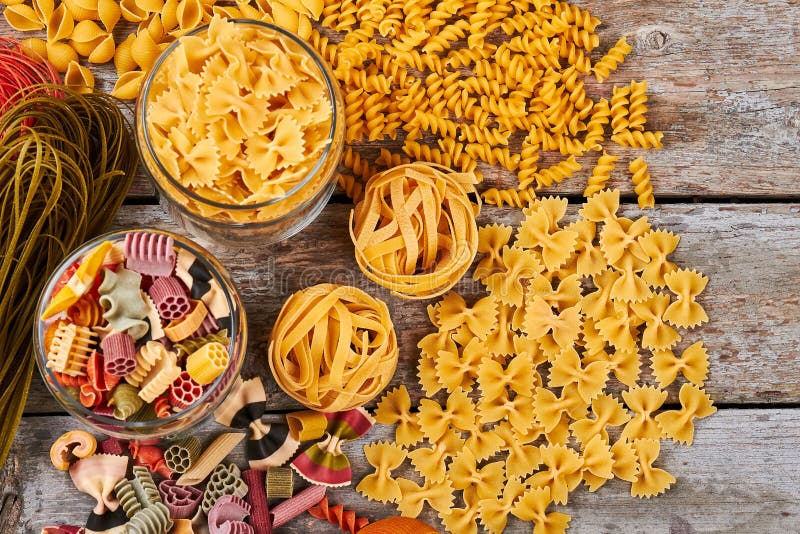 Many Beautiful Italian Pasta on the Old Background. Stock Photo - Image ...