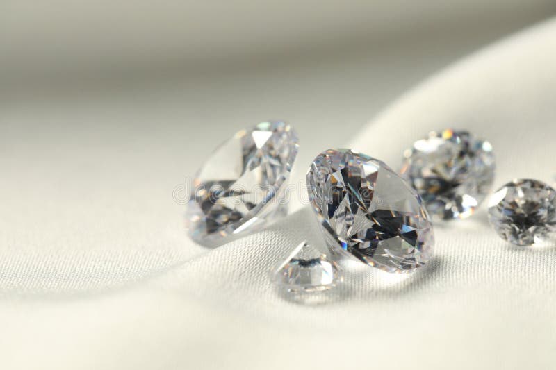 Many Beautiful Shiny Diamonds on White Fabric, Closeup. Space for Text ...