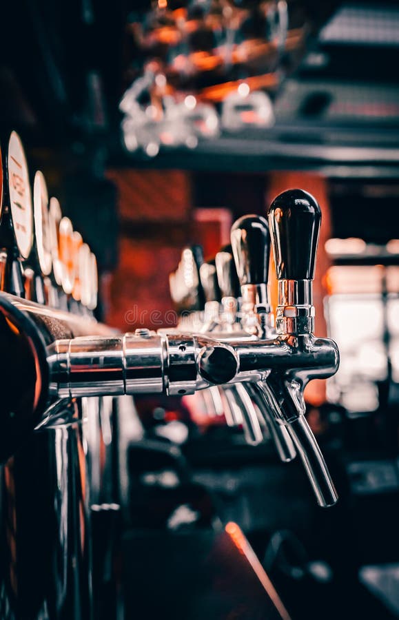 Many Beer Taps in Bar or Pub Stock Photo - Image of focus, beverage ...
