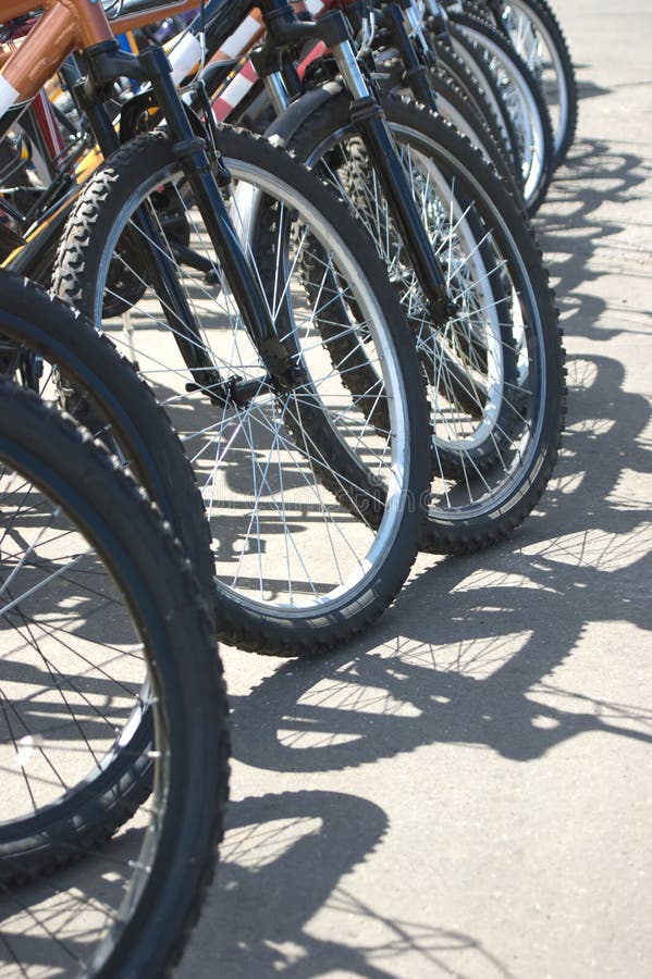 Many bike wheels closeup stock photo. Image of fitness - 27665878