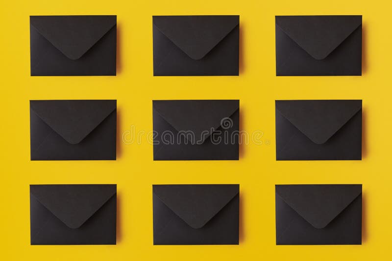 Black Envelopes on the Yellow Background. Mail Concept Stock Photo ...