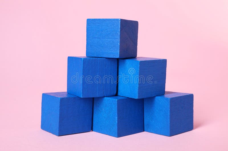 Many Blank Blue Cubes on Pink Background, Closeup Stock Photo - Image ...