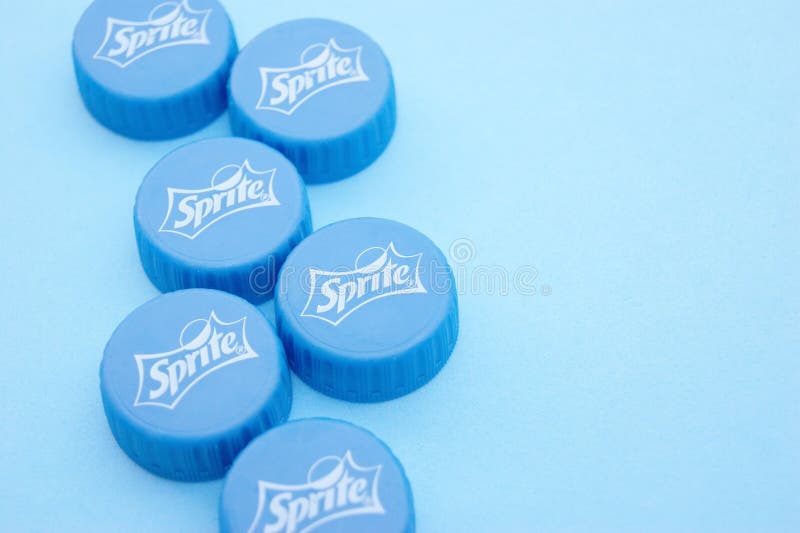 Many of Blue Sprite Drink Caps on a Blue Background. Editorial Stock ...