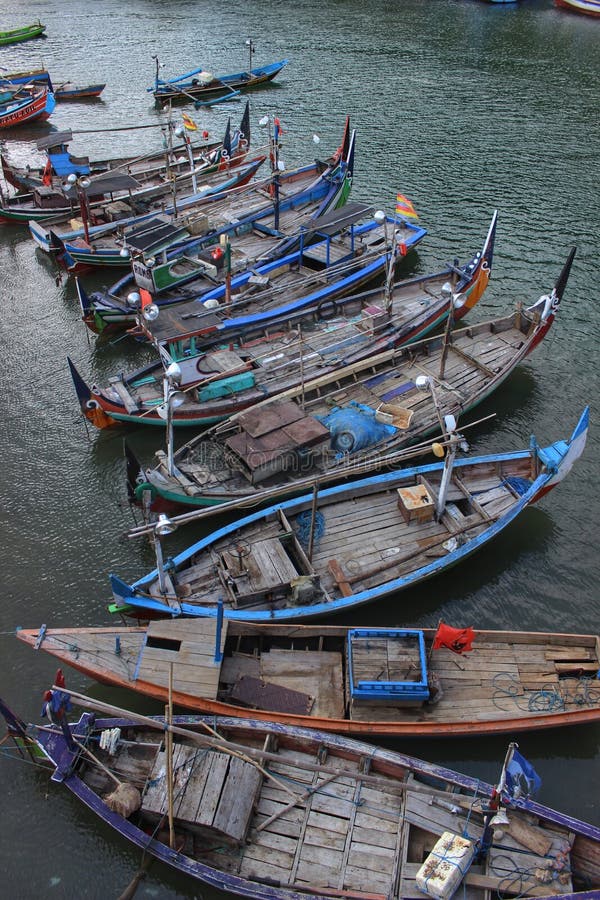 Row of boats on the beach stock photo. Image of nautical - 104028948