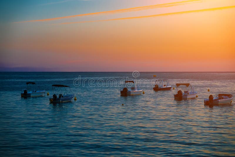 Many boats at sunset stock image. Image of ocean, nautical - 311648385