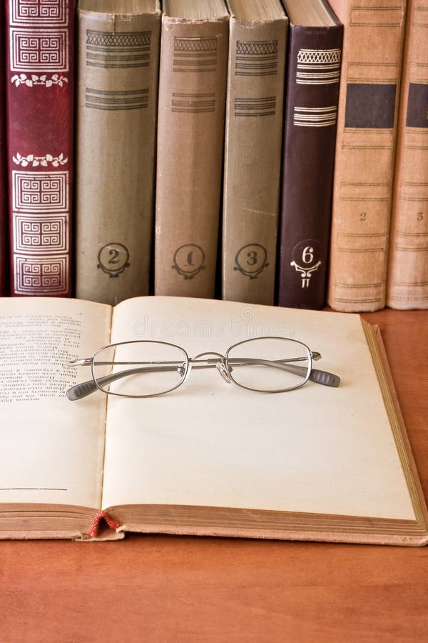 Many books and glasses stock photo. Image of stack, open - 12623782