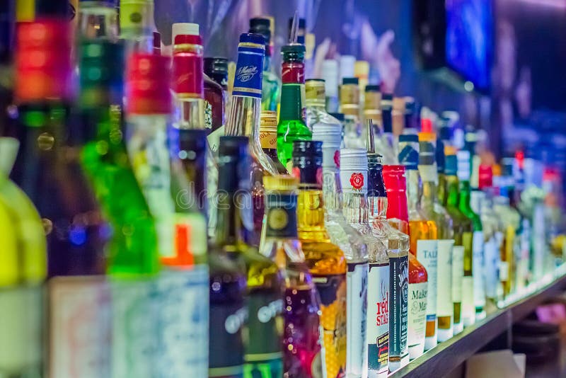 Lot Of Alcohol Bottles In A Shelf Stock Photo - Image of dark, brewed ...