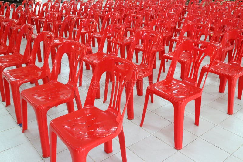 Many Bright Red Plastic Chairs Arranged in a White Floor in the Meeting ...
