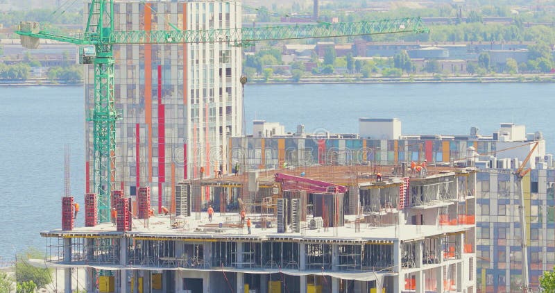 Many Builders are Building a Multi-storey Building. Industrial Exterior ...