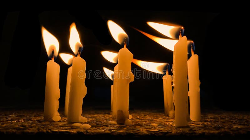 Candlelight in the dark stock photo. Image of yellow - 107049130