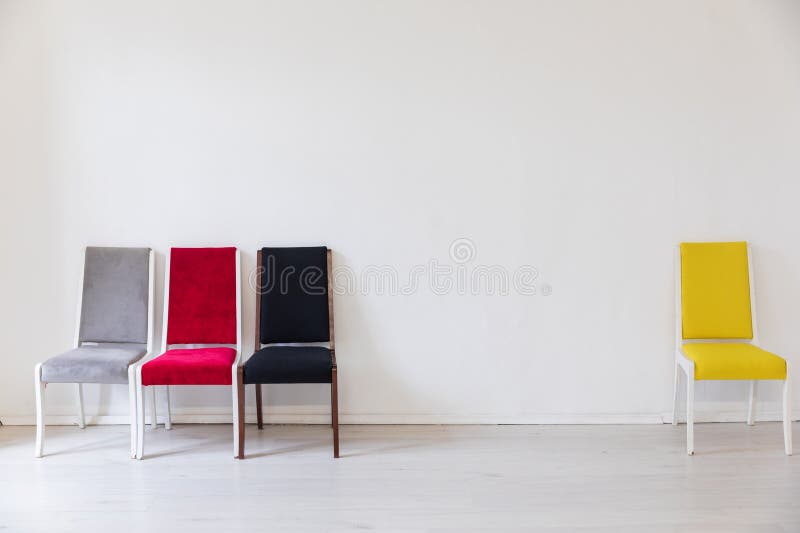 Many Chairs of Different Colors in the Interior of an Empty White ...