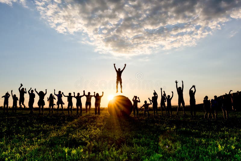 Many Children Jumping at the Same Time in the Sunset Stock Photo ...